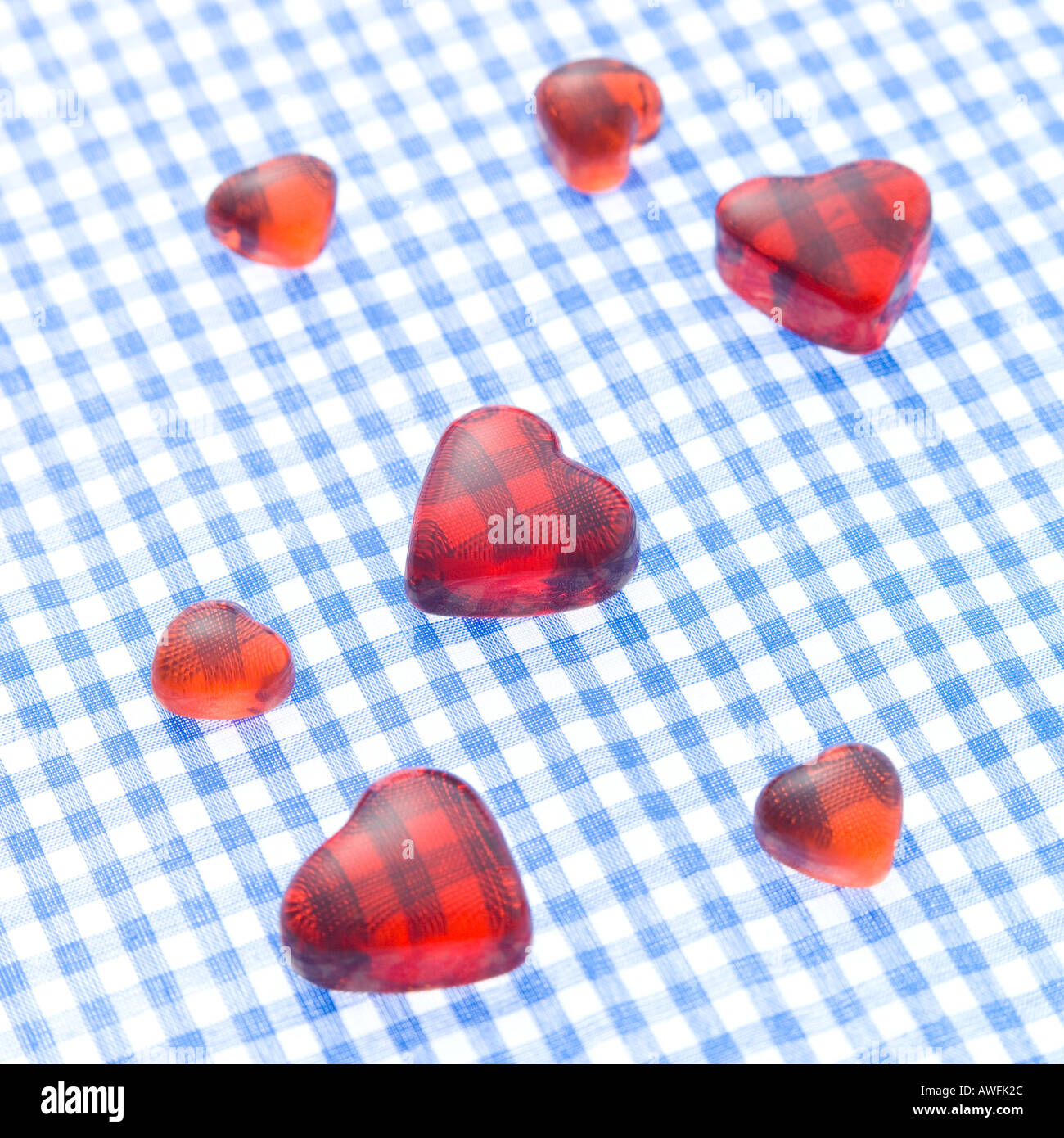 Heart shaped objects on check cloth Stock Photo - Alamy