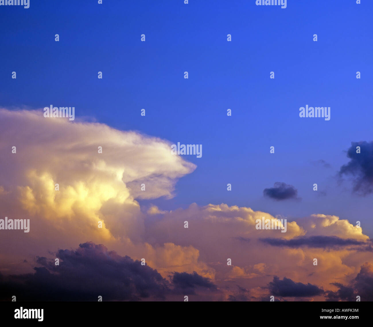 Cumulonimbus thunderclouds in a blue sky, approaching thunderstorm ...