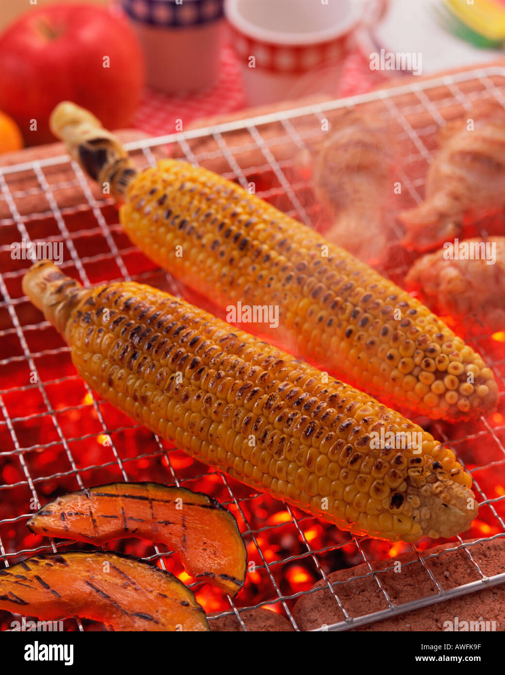 Grilled corn over charcoal Stock Photo - Alamy