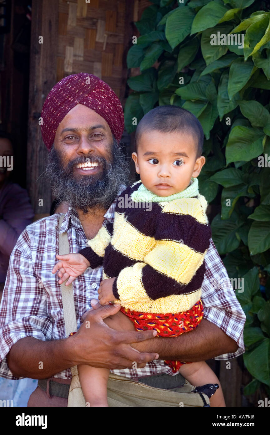 Stock photograph of a proud Sikh father and his son in the Myanmar town ...