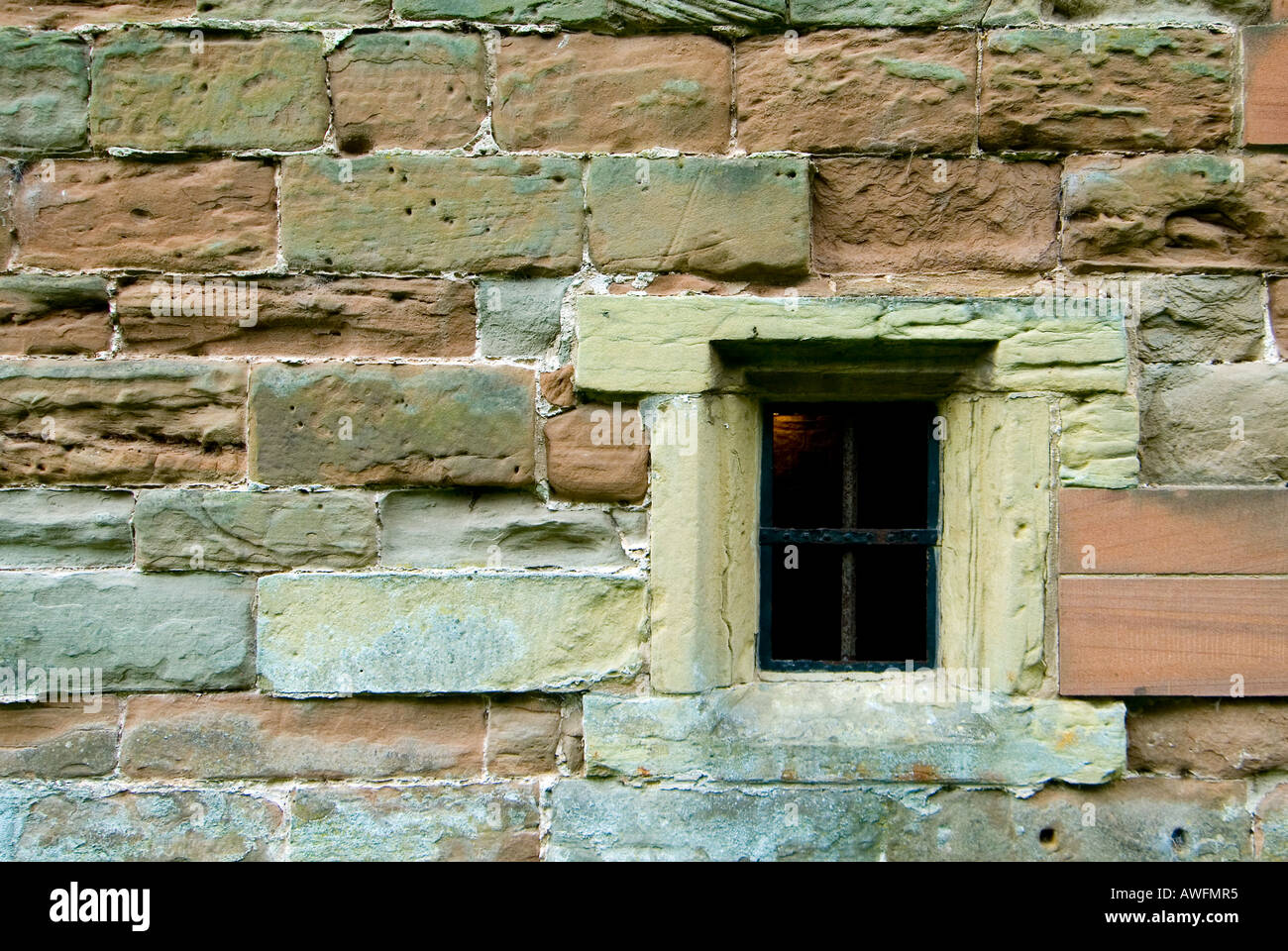Sandstone wall with offset window Stock Photo - Alamy