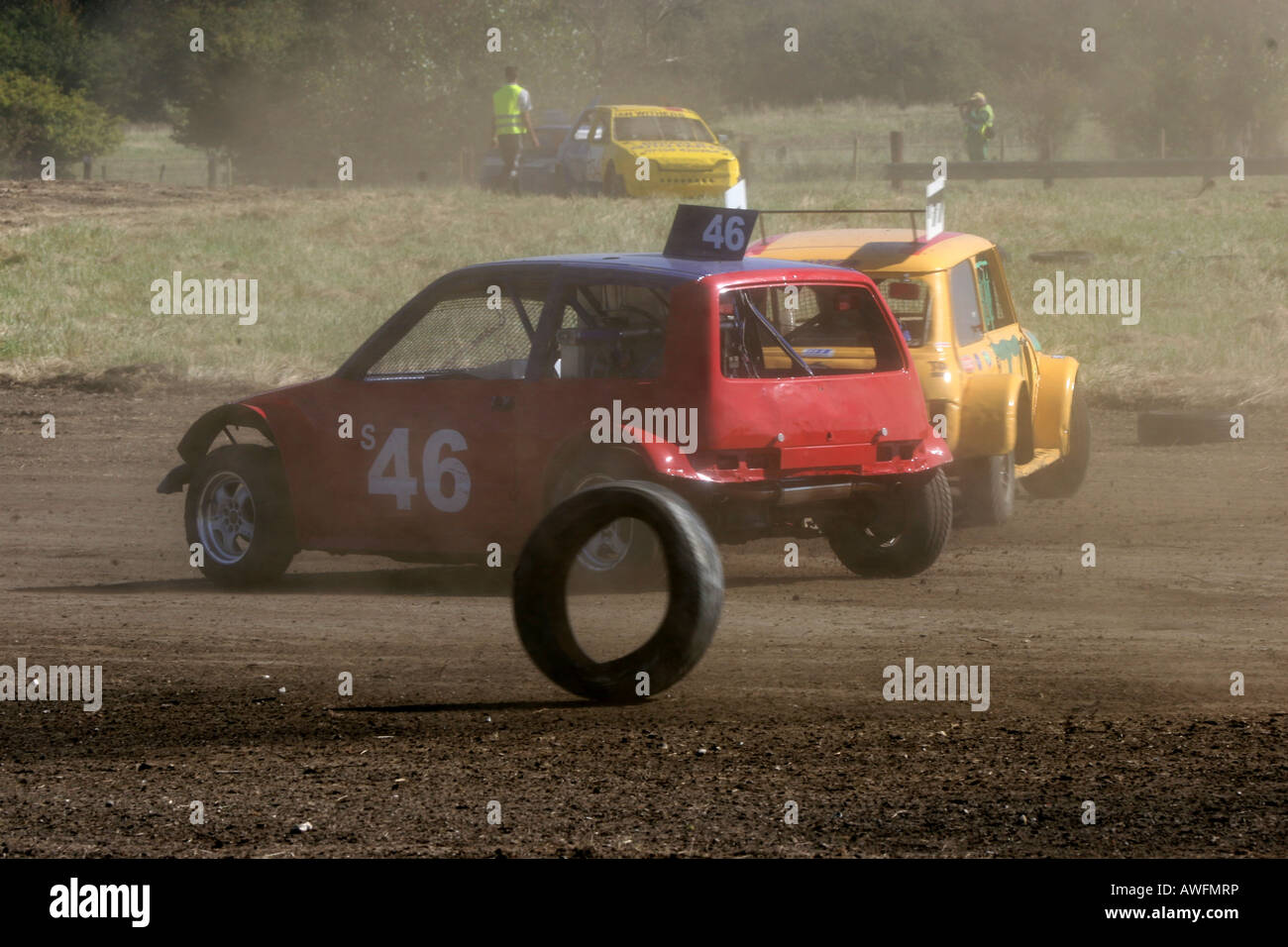 Autograss banger racing with a tyre rolling across the frame Stock ...