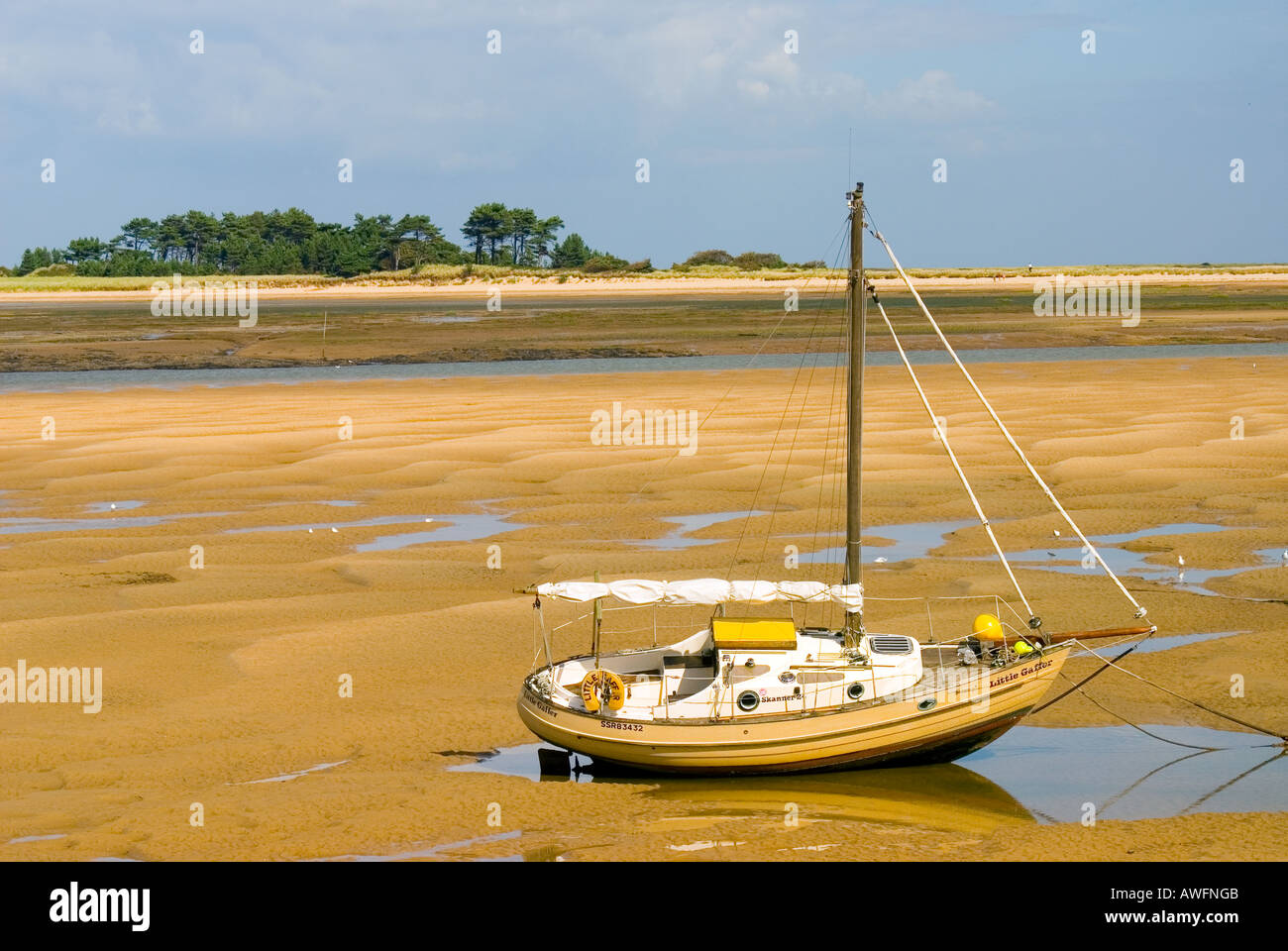 Marooned boat on the beach in Wells Next To Sea in Norfolk on Englands ...