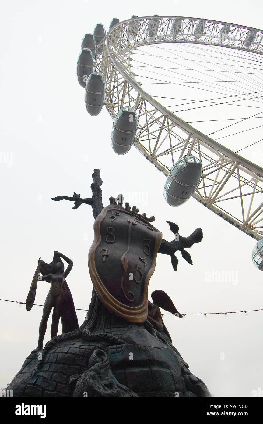 The London eye with a statue in the foreground on the south bank of the ...