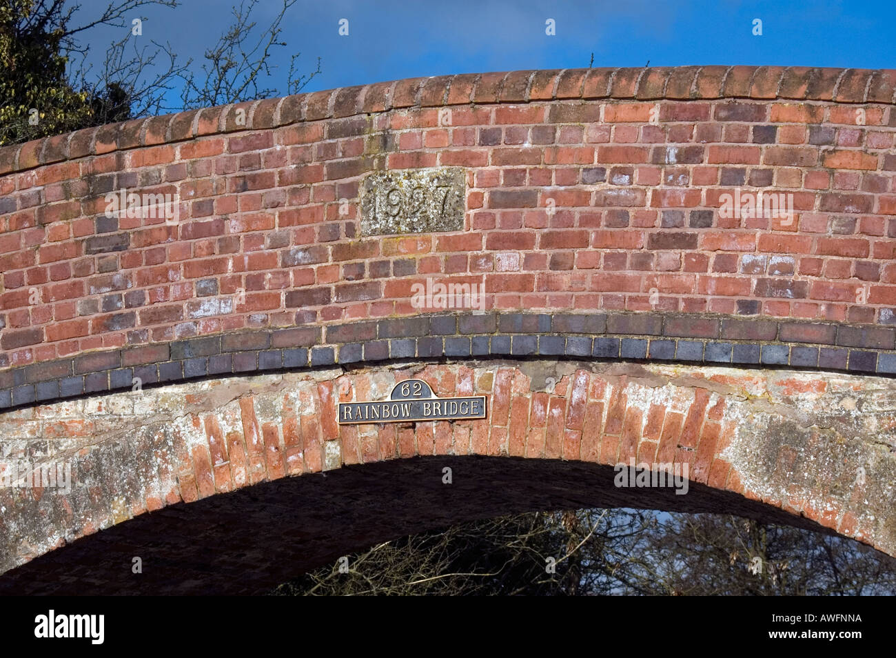 Red brick canal bridge over the Grand Union canal in Leicestershire ...