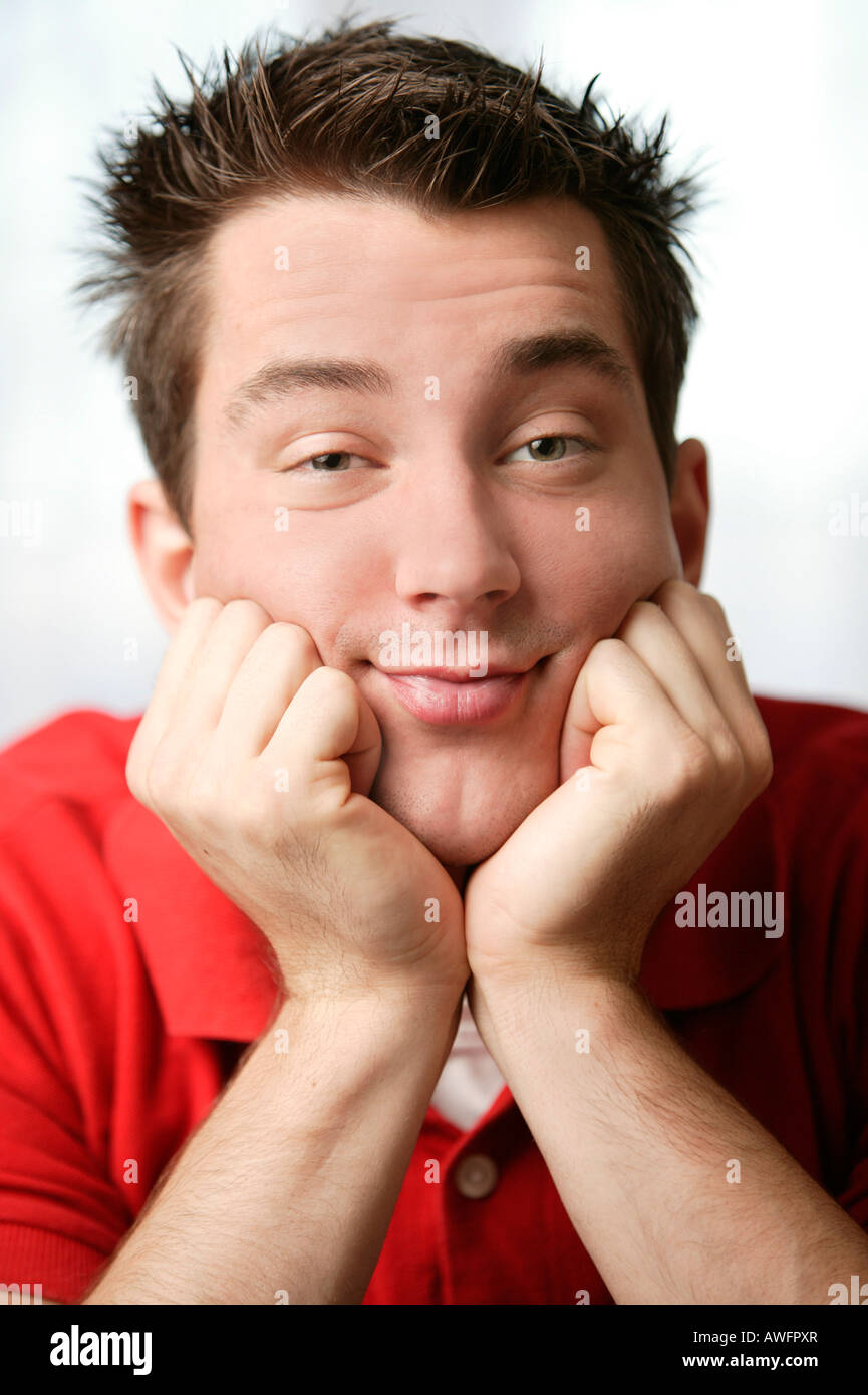 Young man looking into the camera, bored Stock Photo - Alamy