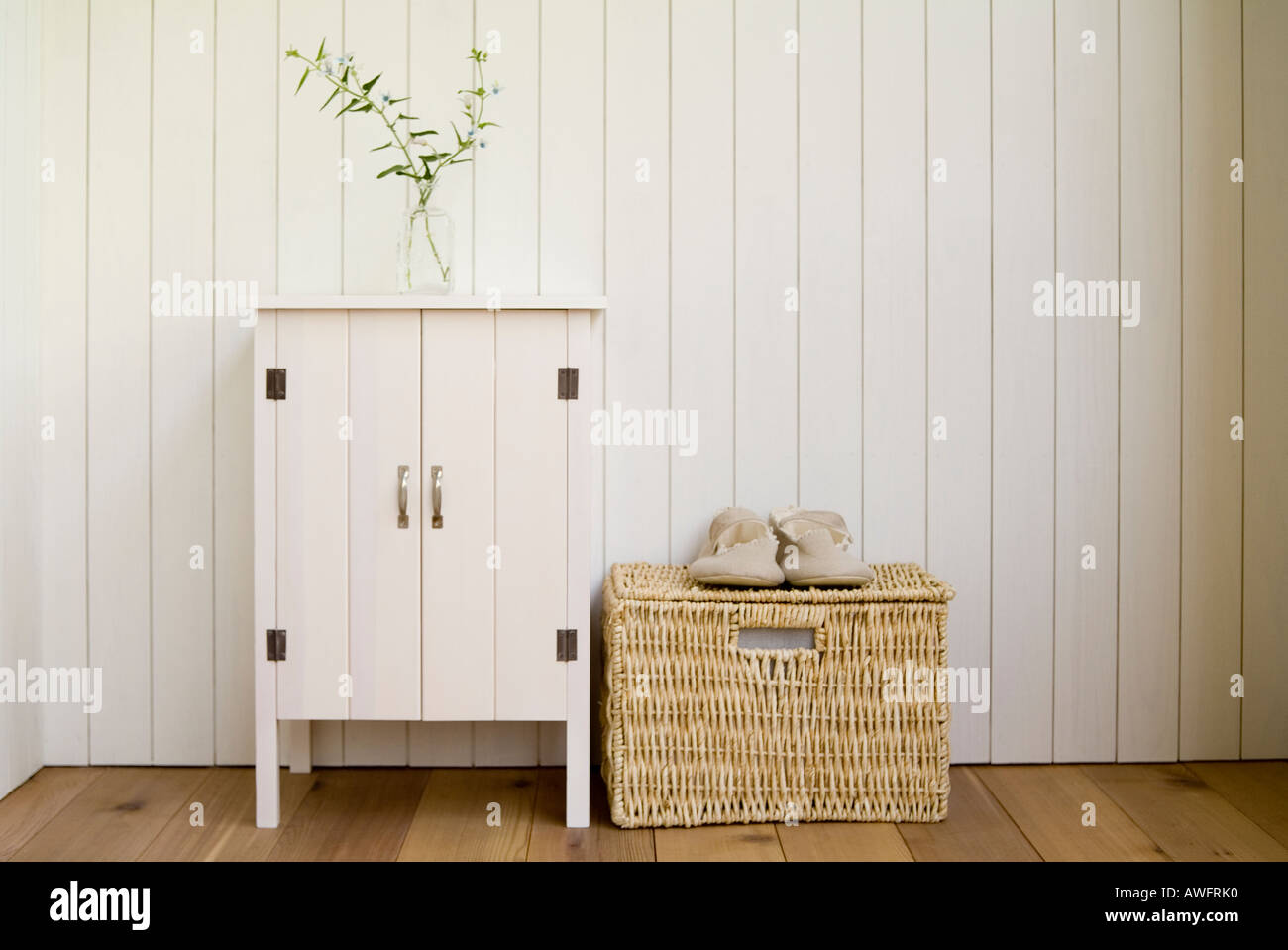 Dresser and laundry container Stock Photo - Alamy