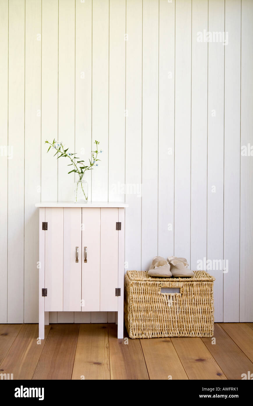 Dresser and laundry container Stock Photo - Alamy