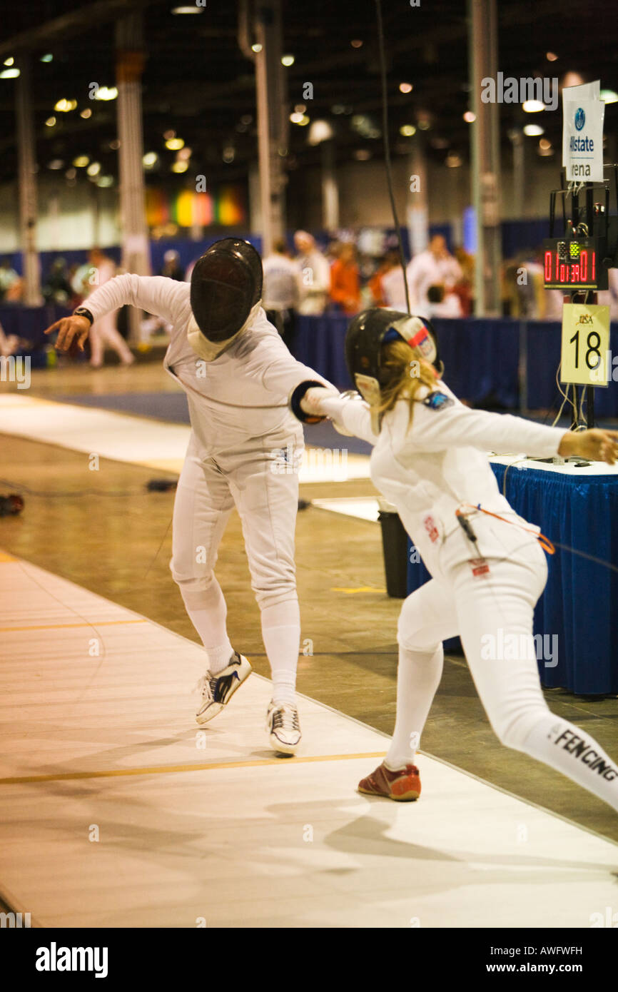 SPORTS Fencing competition epee weapon women in bout on strip lunging ...