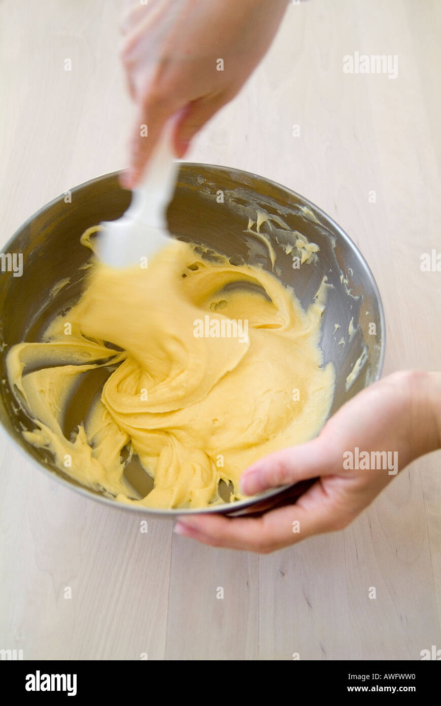 A woman mixing flour and egg, blurred motion Stock Photo - Alamy