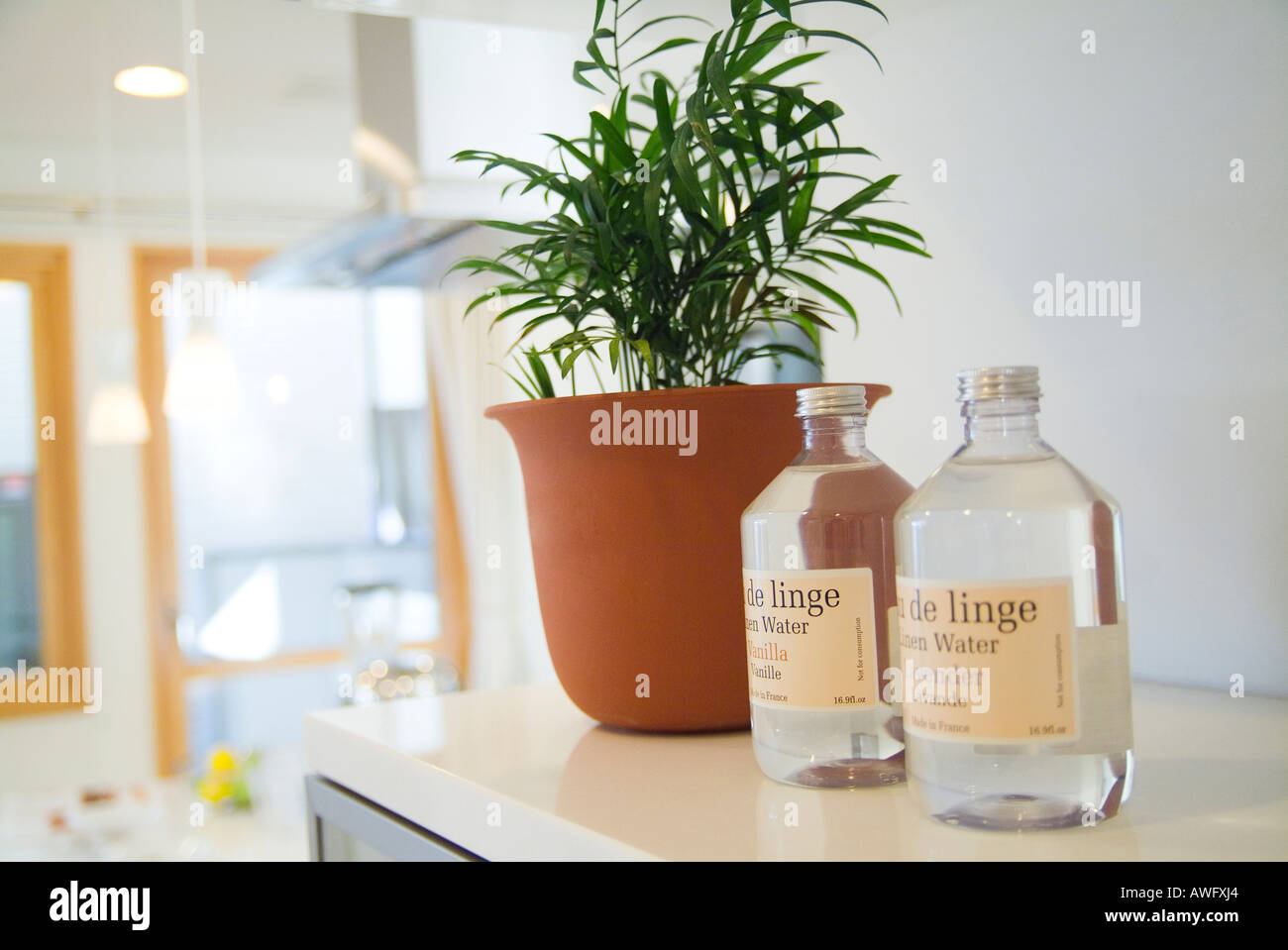 Linen water and potted plant Stock Photo - Alamy