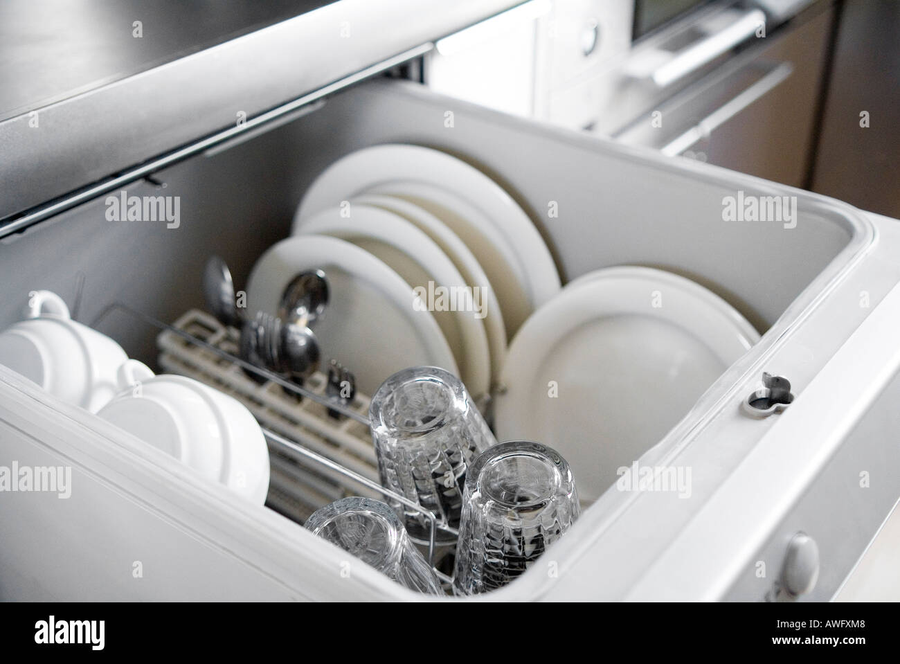 Plates in dishwasher Stock Photo - Alamy