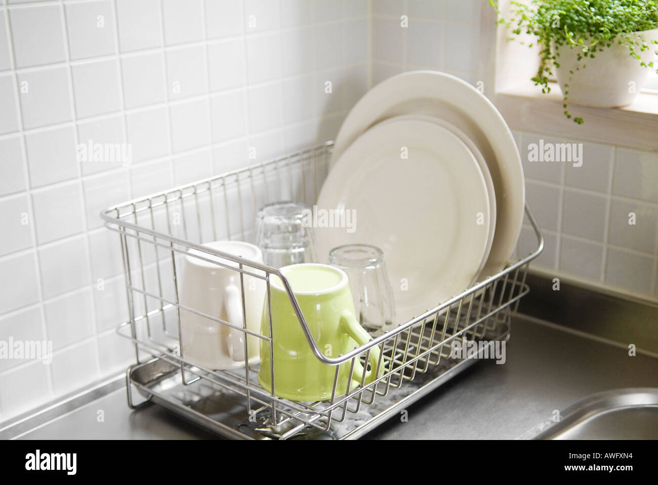 Washed dishes in dish rack Stock Photo - Alamy