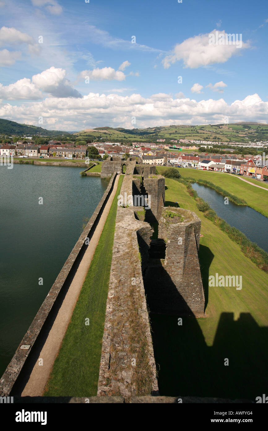 Aerial view of Caerphilly Castle wall ruins water filled moat and inner ...