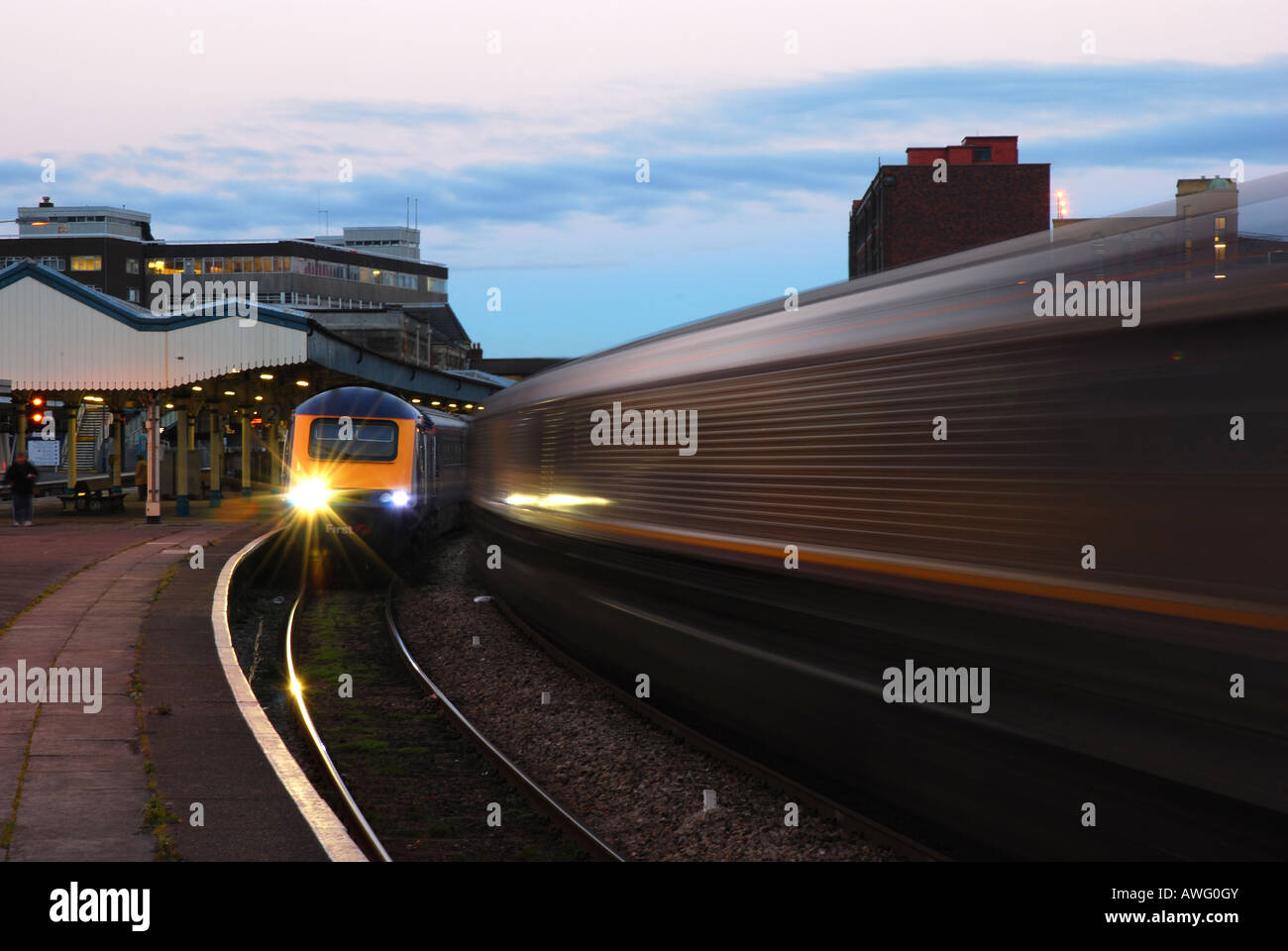 Trains passing through a station Stock Photo - Alamy
