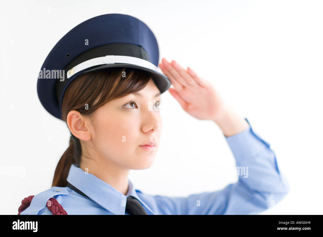 A female security guard saluting Stock Photo - Alamy