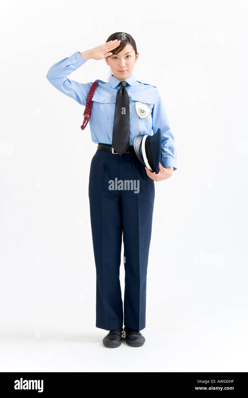 A female security guard saluting Stock Photo - Alamy