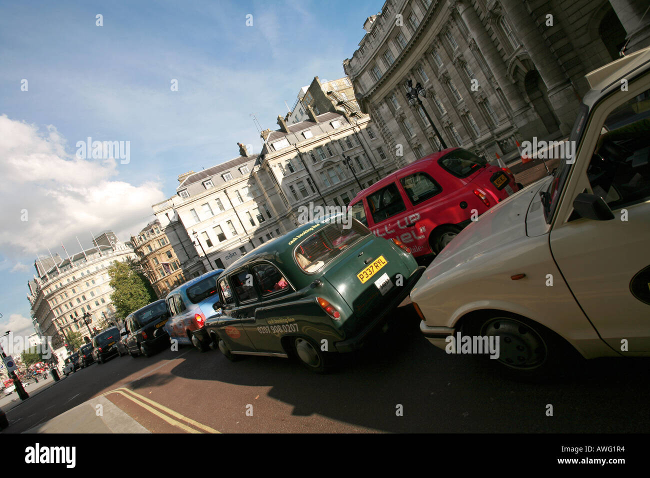 Multi coloured London taxi cabs cars stationary in congestion trafiic ...