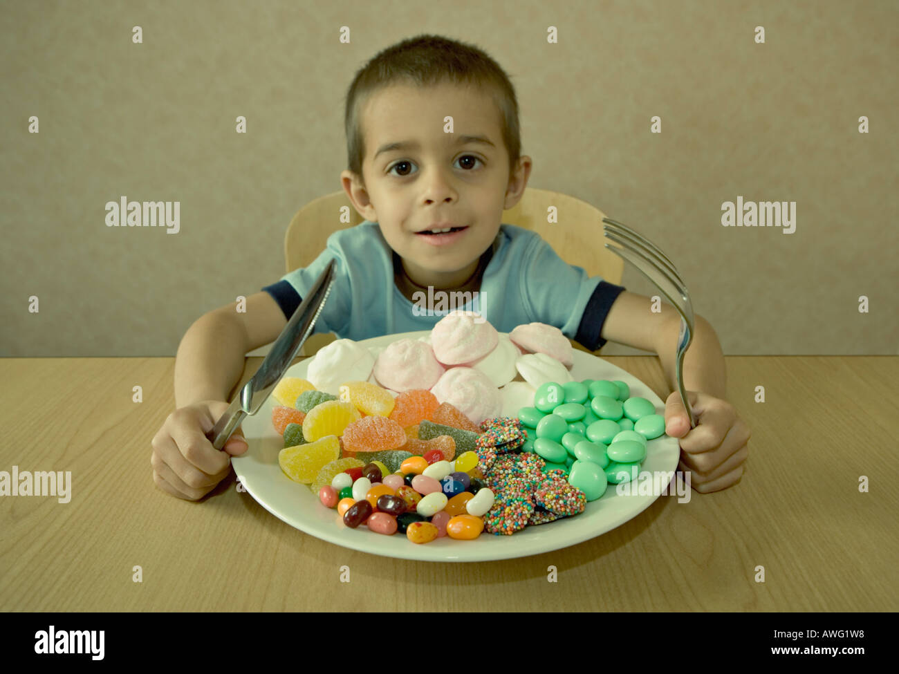 Obese child eating sweets hi-res stock photography and images - Alamy