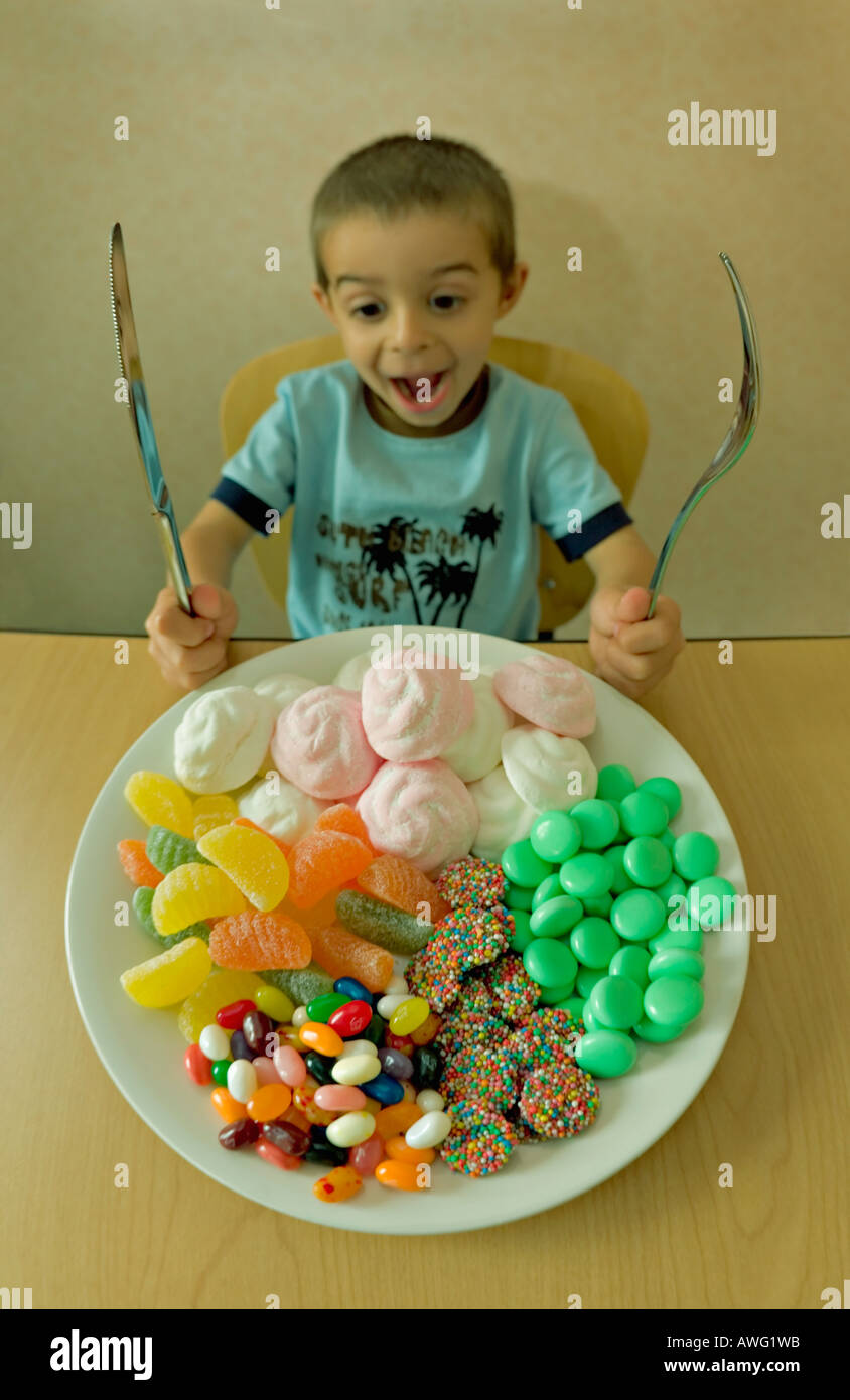 Obese child eating sweets hi-res stock photography and images - Alamy