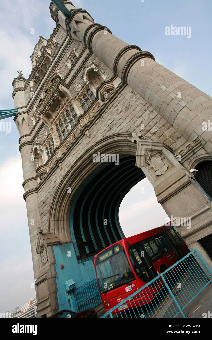 A typical red London bus drives over the world famous landmark building ...