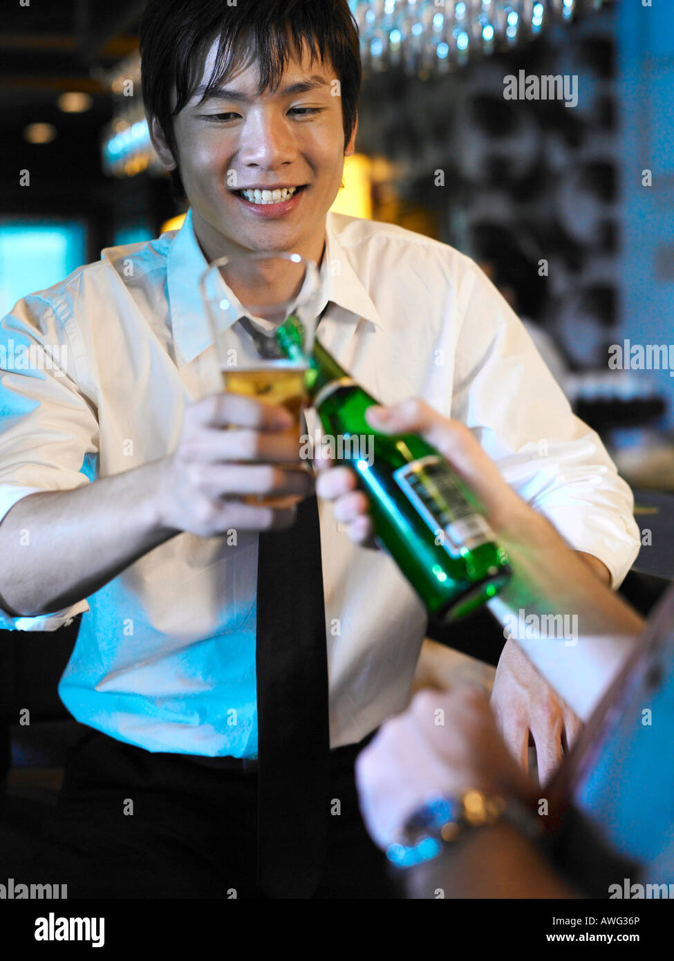two men drinking beer in a bar Stock Photo - Alamy