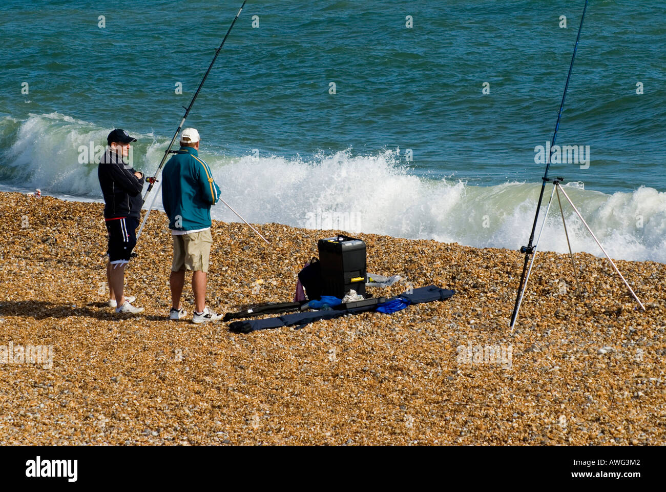 Two men beach fishing hi-res stock photography and images - Alamy