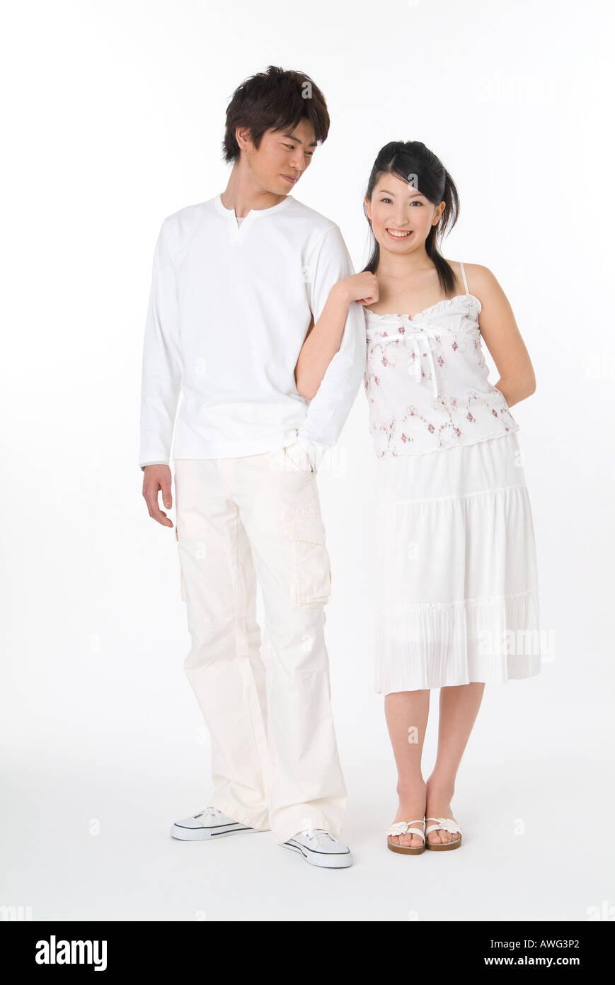 Young couple standing Stock Photo - Alamy