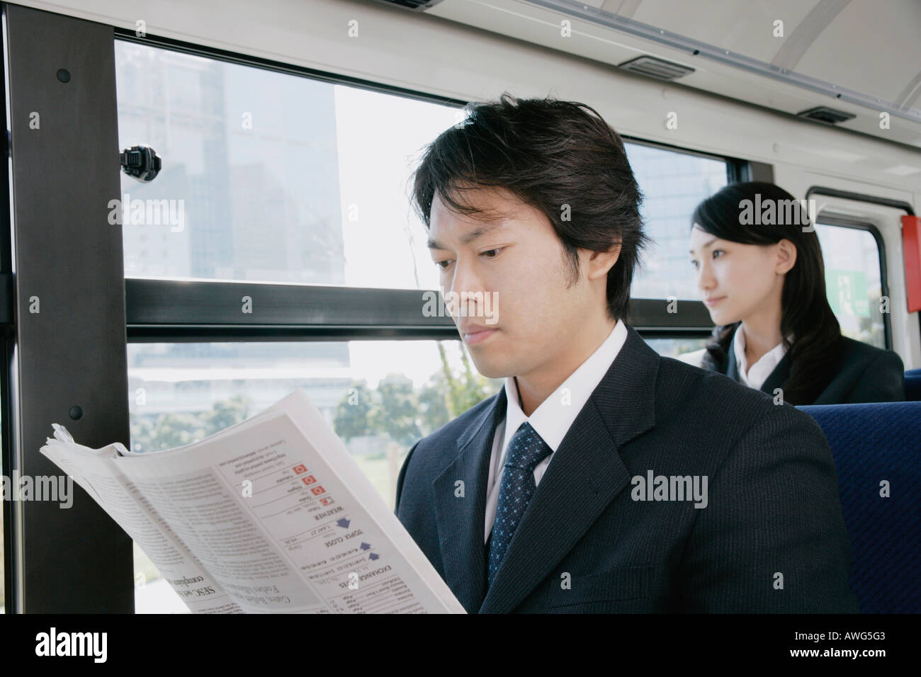 Bus reading newspaper hi-res stock photography and images - Alamy