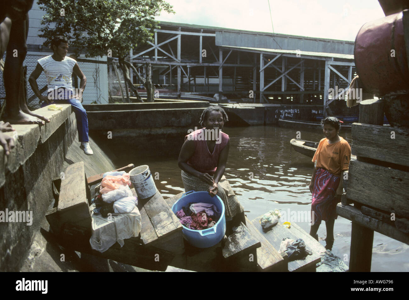 Women washing clothes Bartica Guyana Stock Photo - Alamy