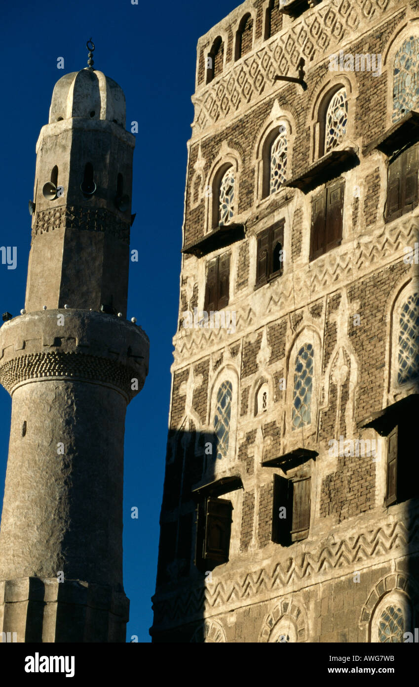 Traditional Yemeni house next to a minaret in the Old City, Sana'a ...