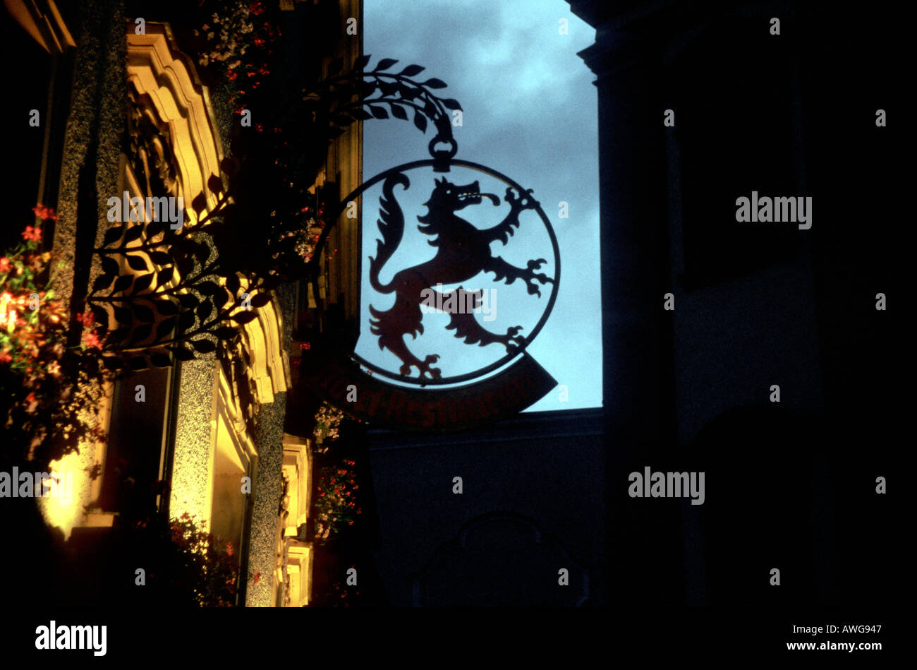 Europe Germany Bavaria Passau a gasthaus sign is silhouetted against ...