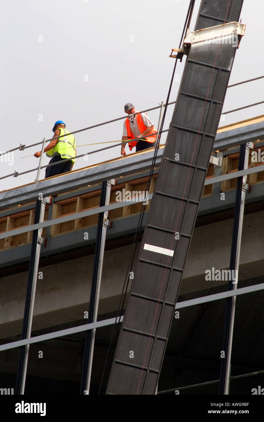 Construction workers on building site Stock Photo - Alamy