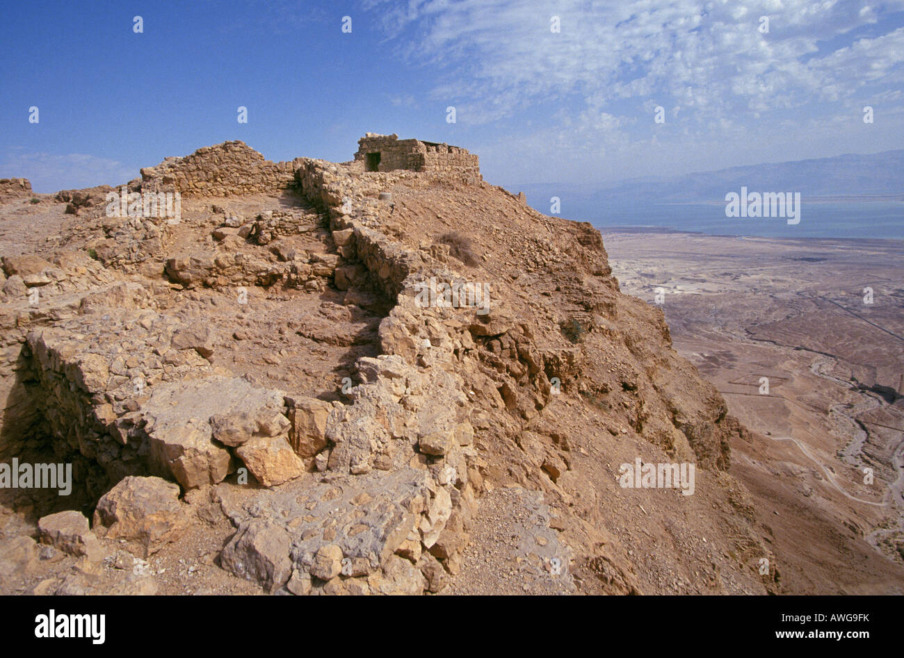 A view of the ruins of the city of Masada high atop a mesa adjacent to ...