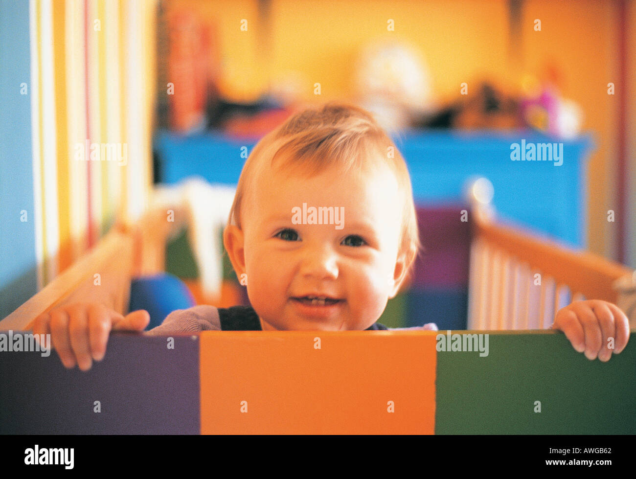 A baby in its cot happy Stock Photo - Alamy