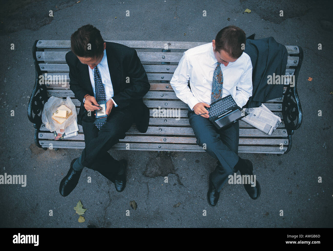 Two men on a bench eating hi-res stock photography and images - Alamy