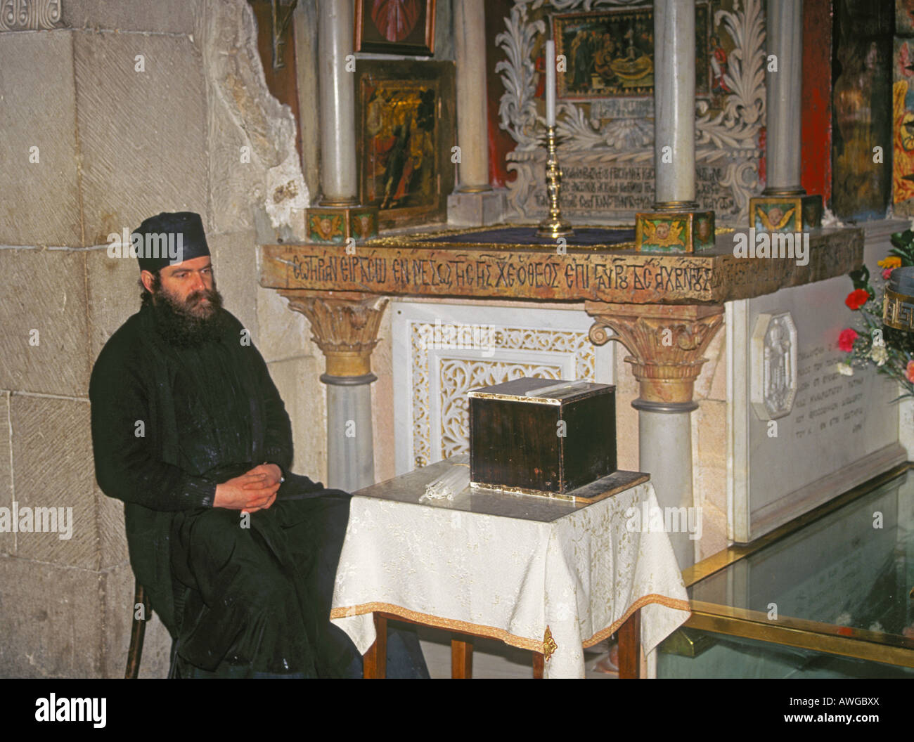 A Coptic priest in the Basicila or Church of the Holy Sepulchre of ...