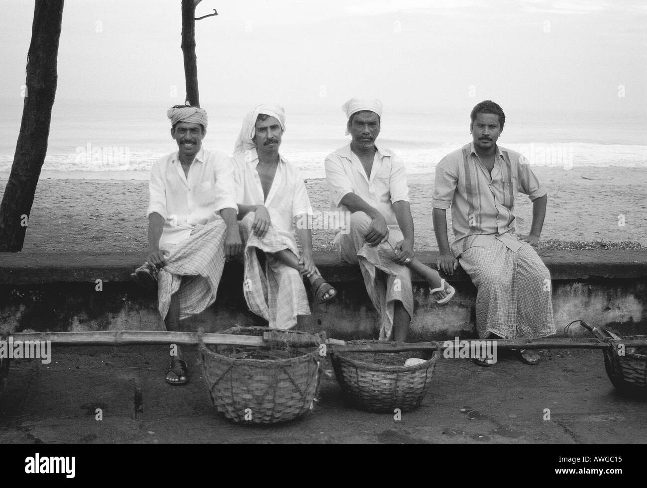 Four black men sitting Black and White Stock Photos & Images - Alamy