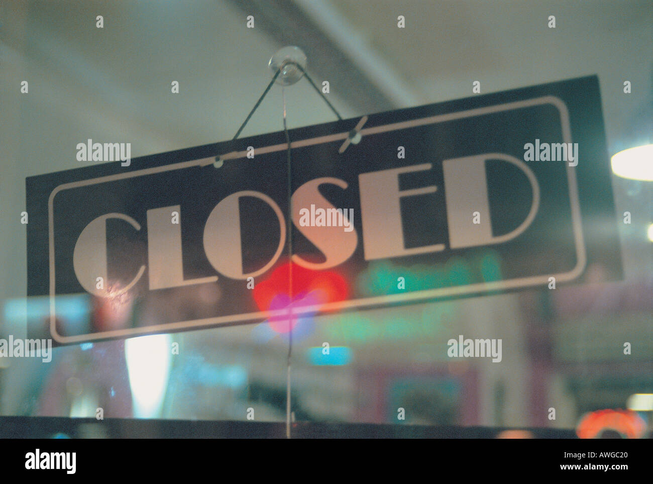 A closed sign hanging on a door Stock Photo - Alamy