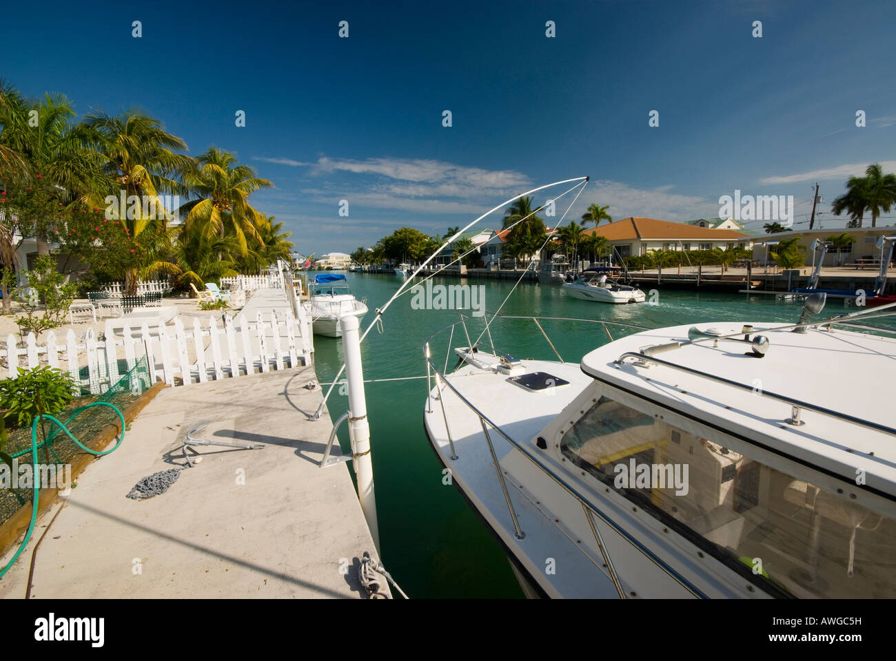 typical scene of canal in florida keys with boats and homes Stock Photo ...