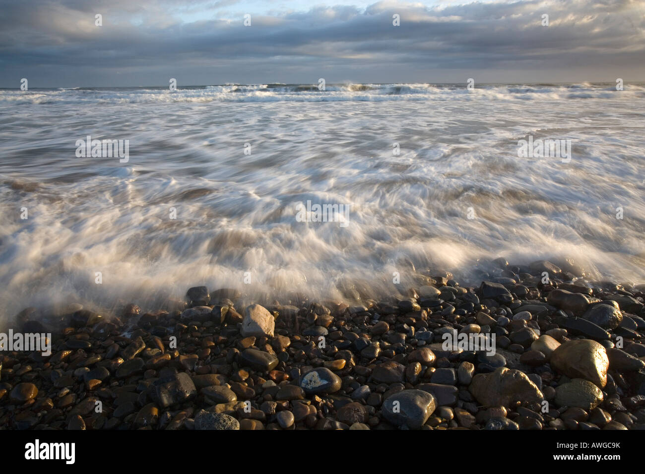 Wave breaking on shingle beach north Yorkshire Coast England Stock ...