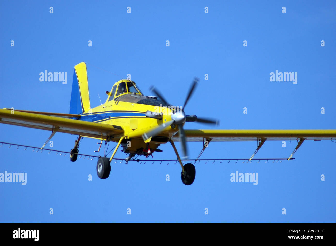 This image of a crop dusting aircraft was captured in flight west of ...