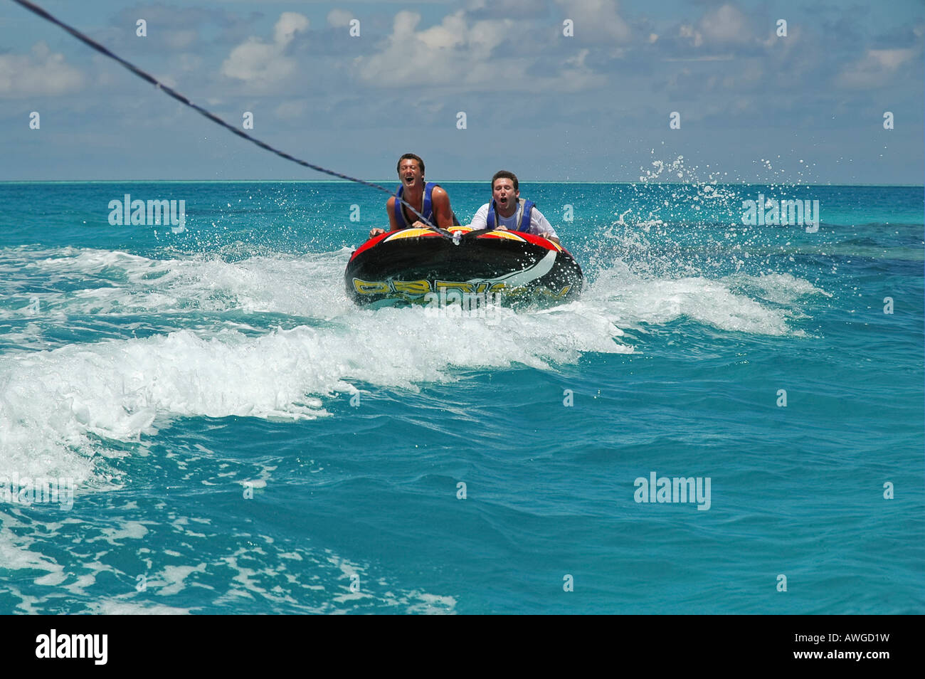 Inflatable tow sea fun waves bounce hi-res stock photography and images ...