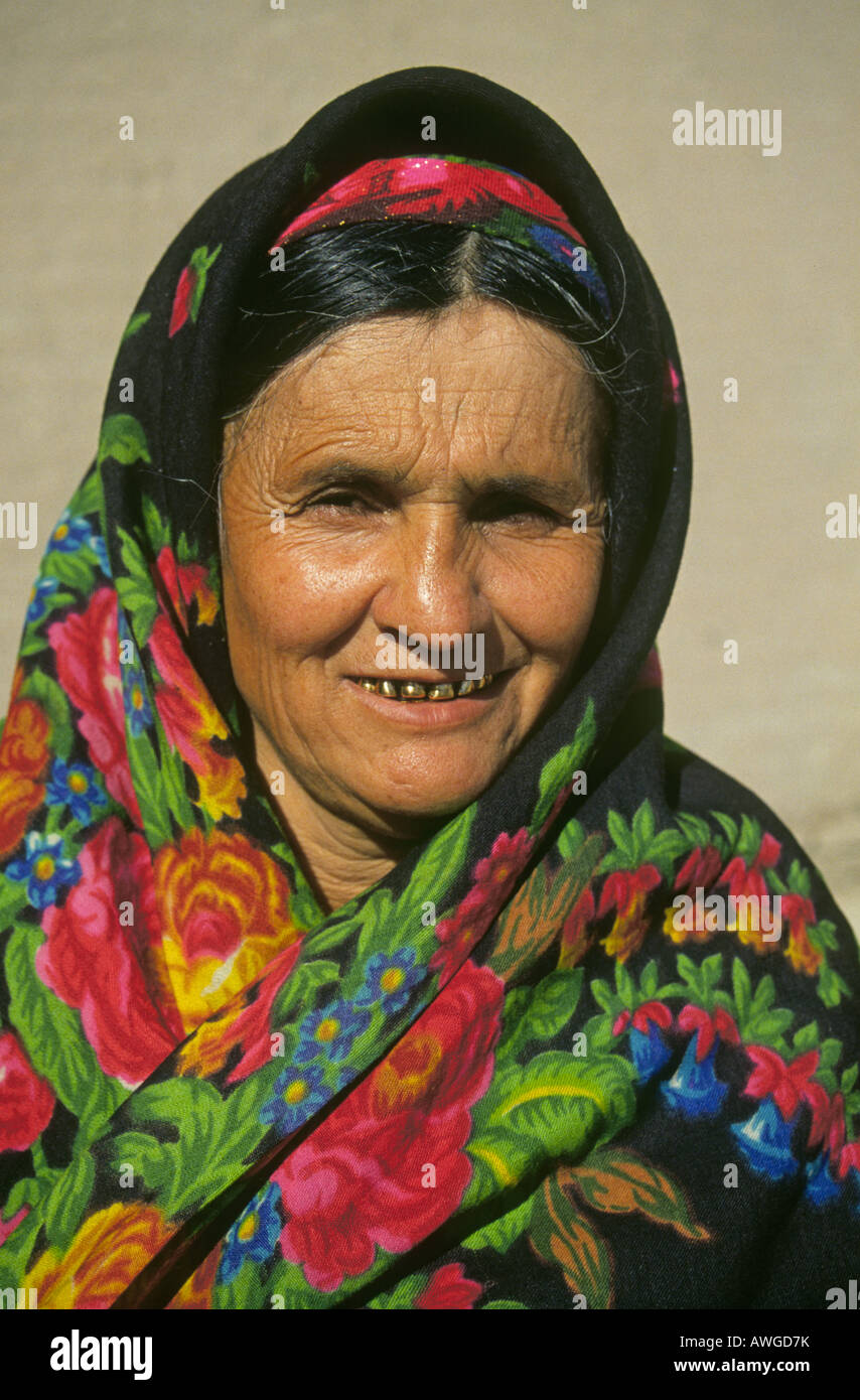 Portrait of a senior Uzbek woman dressed in traditional Muslim dress in ...