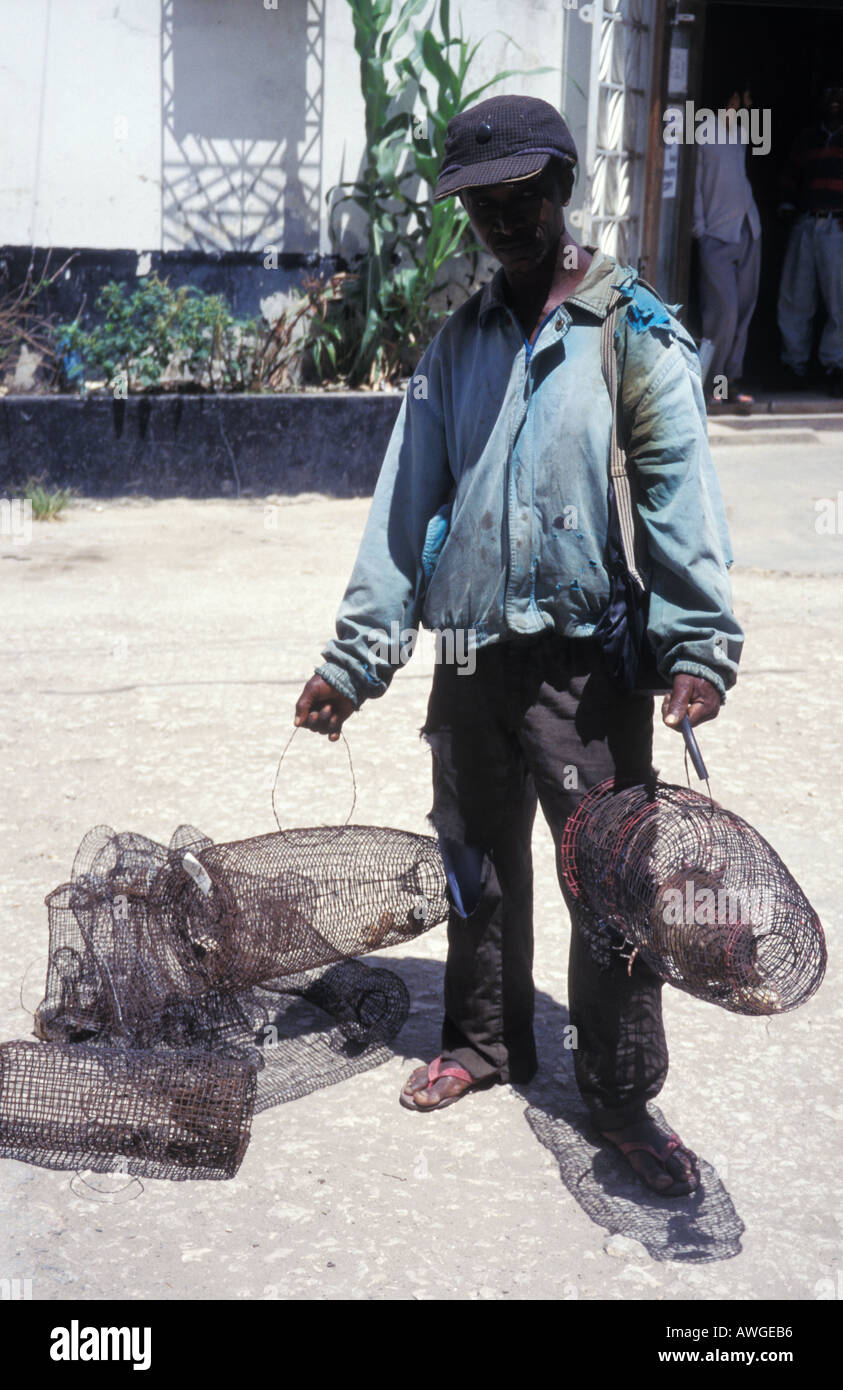 Stone Town rat catcher with giant rat in cage Zanzibar, Tanzania, East ...