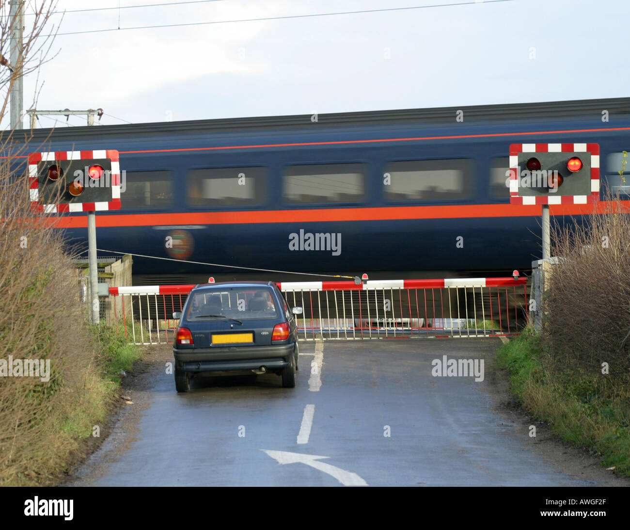 Car waiting to cross level crossing hi-res stock photography and images ...