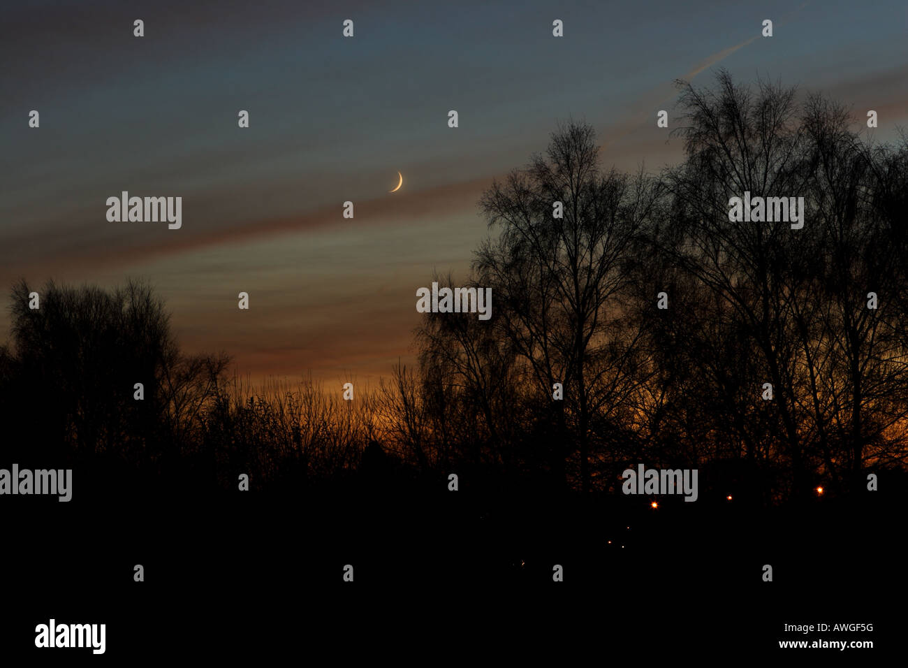 Moon at sunset Stock Photo - Alamy