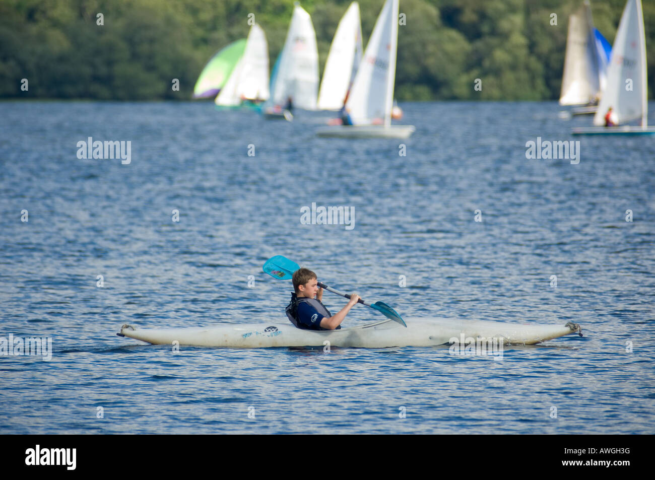 Side view of a male kayaker in grey kayak on Bassenthwaite Lake, in ...