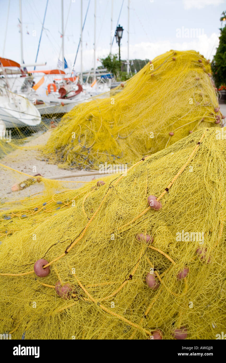 yellow fishing nets at the harbour Stock Photo - Alamy
