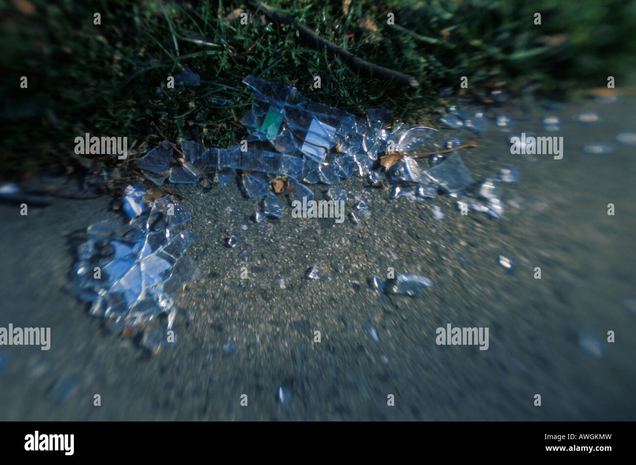 pieces of broken glass on sidewalk Stock Photo - Alamy